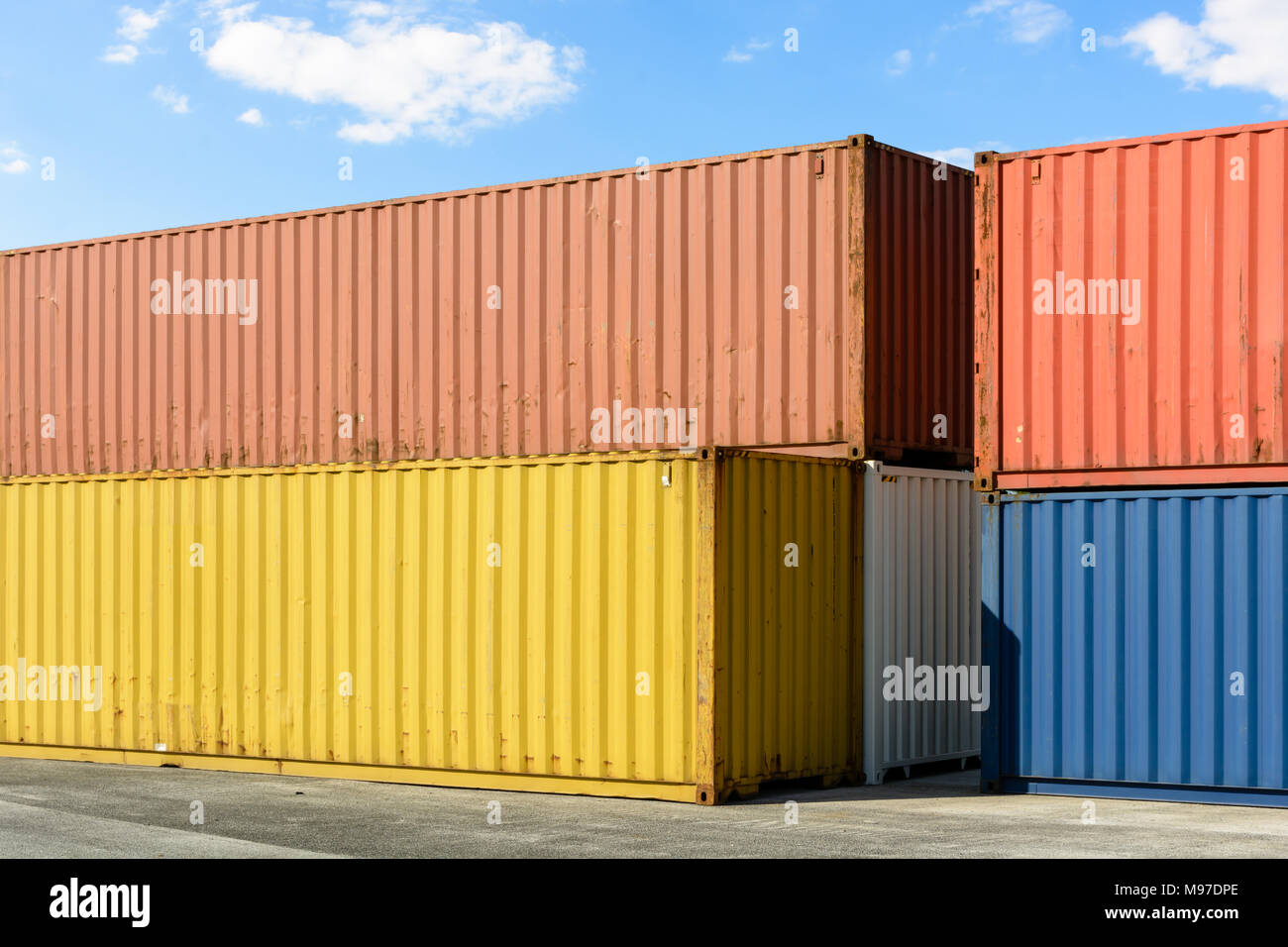 Colorful containers stacked in a river port in the suburbs of Paris ...