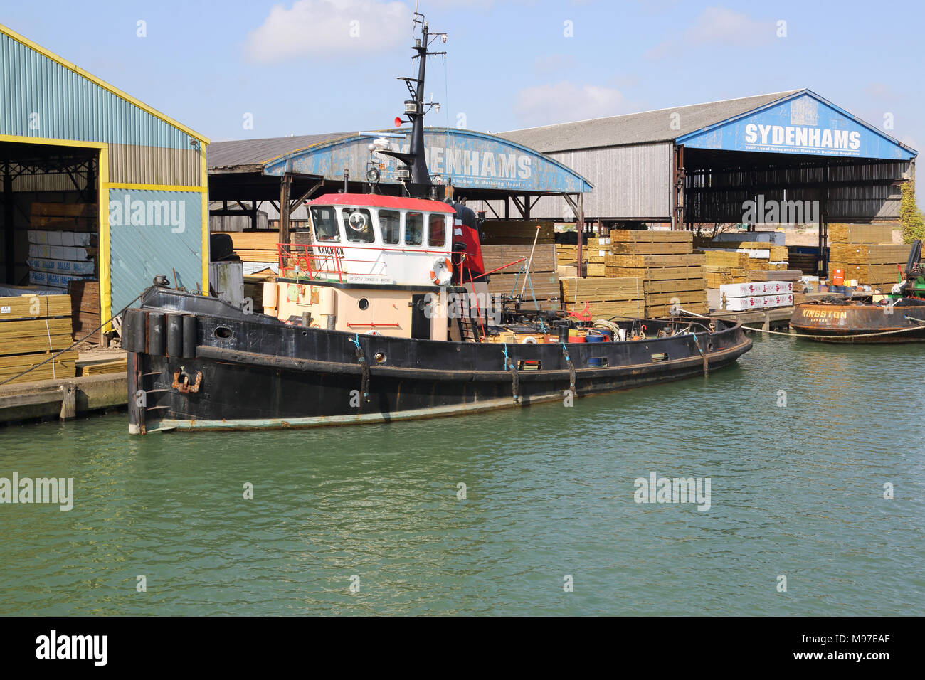ships moored in the docks in the coastal town of poole on the dorset ...