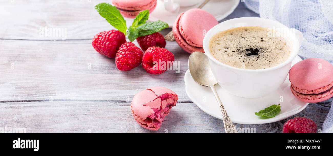 Cup of coffee with french raspberry macaroons Stock Photo - Alamy
