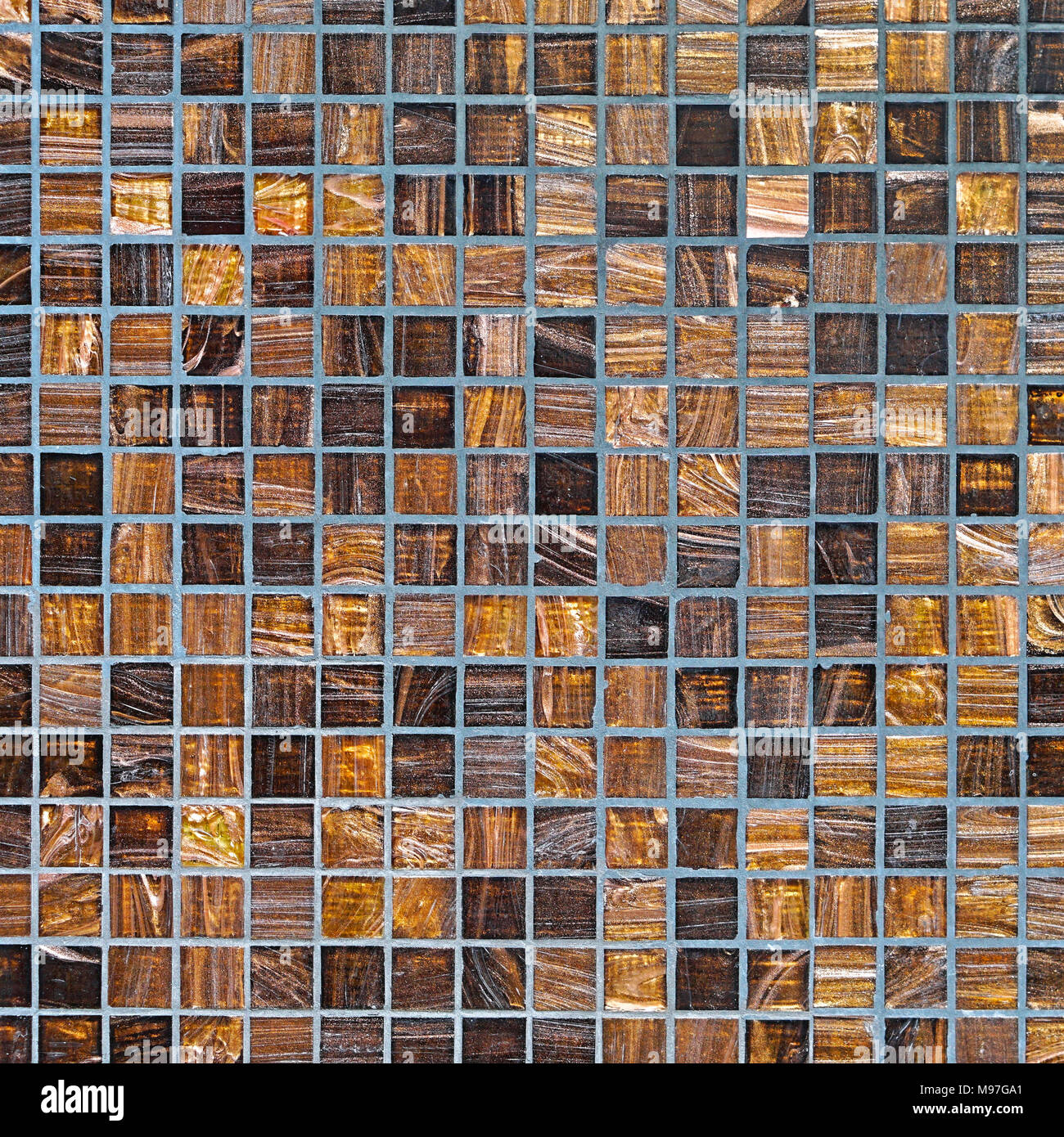 Small square mosaic wall tiles in brown Stock Photo - Alamy