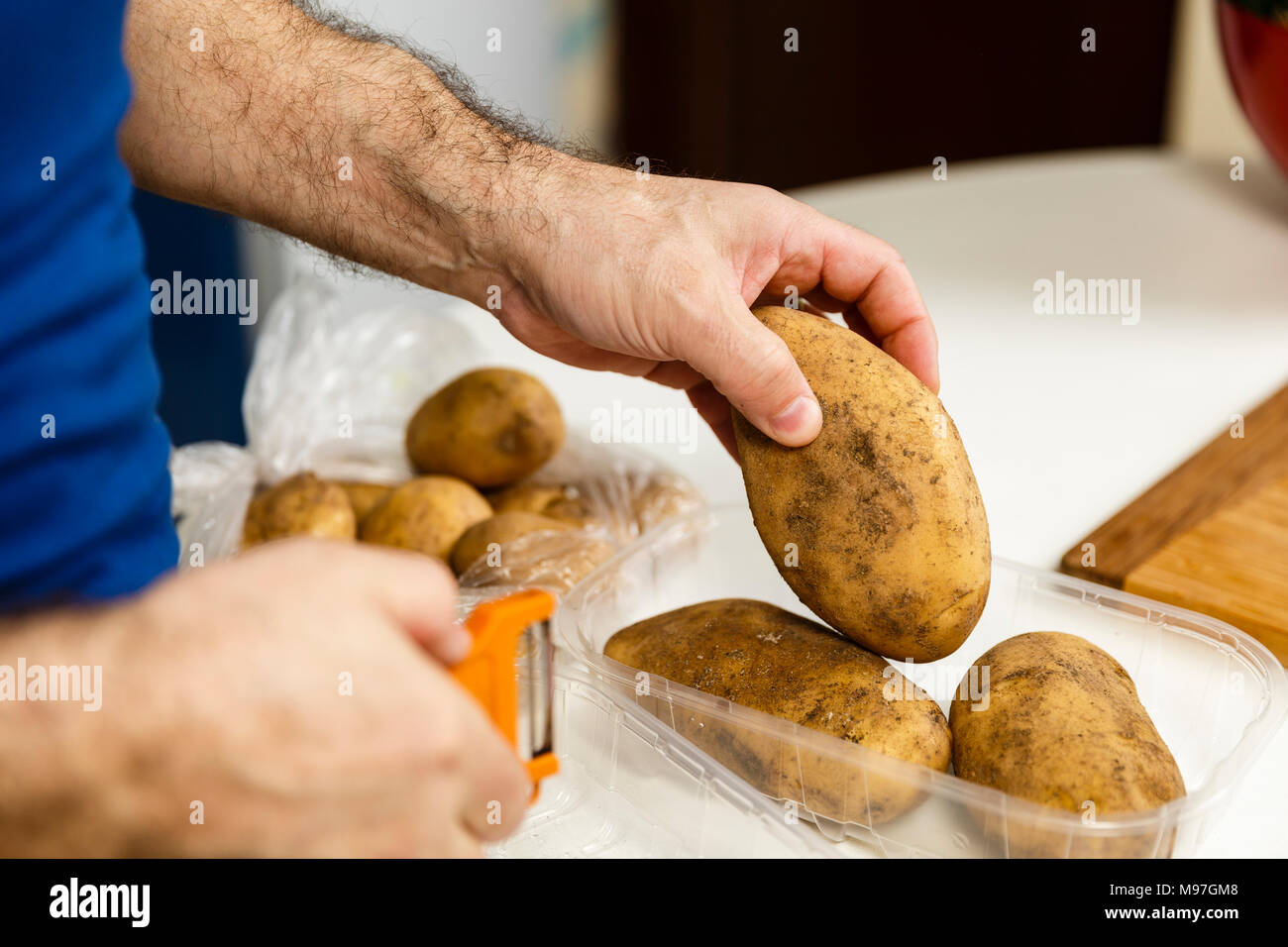Man holding young potatoes hi-res stock photography and images - Alamy
