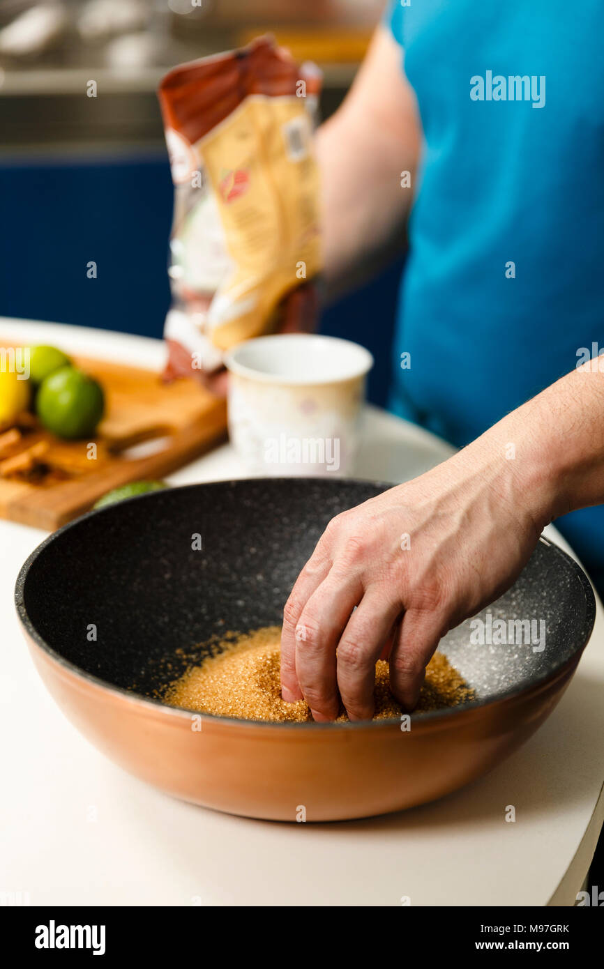 Man adding ingredients caramelized hi-res stock photography and images ...