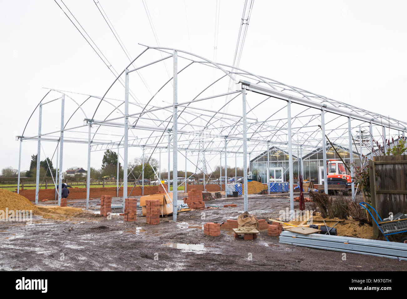 Framework of extension being built at a garden nursery Stock Photo - Alamy