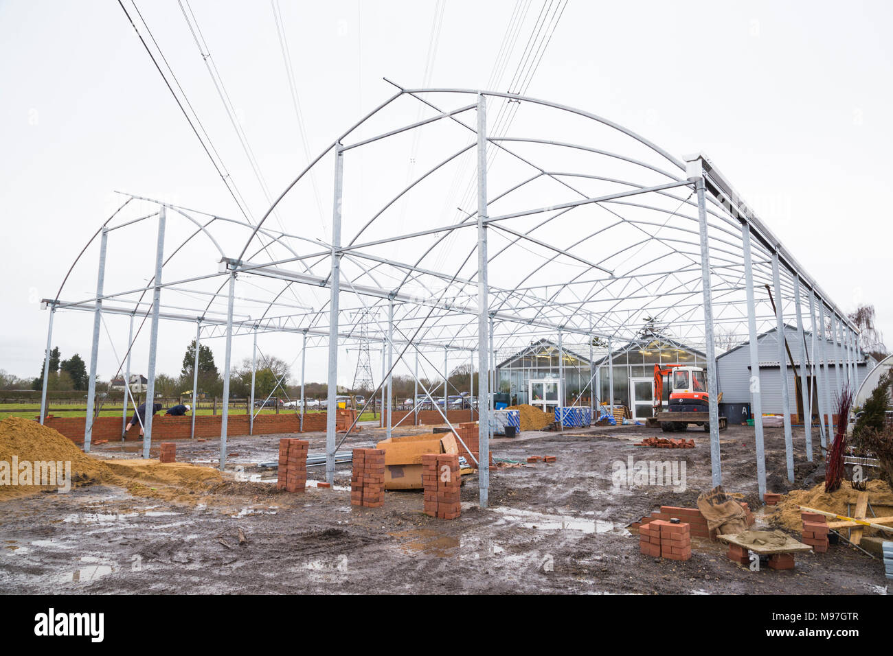 Framework of extension being built at a garden nursery Stock Photo - Alamy