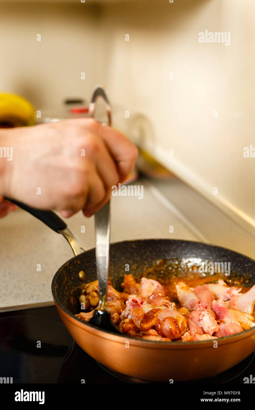 Adding vegetables in a frying pan hi-res stock photography and images ...