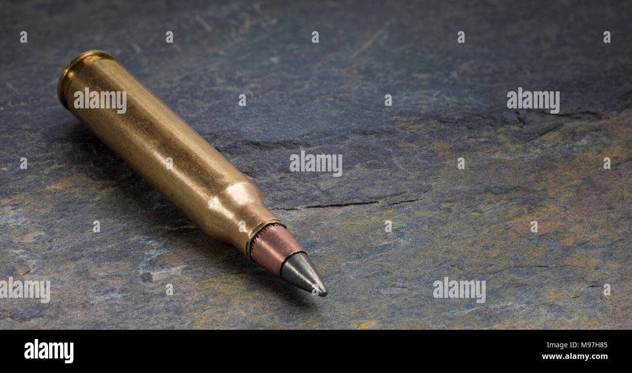 Grey stone background with the military M855 EPR cartridges Stock Photo ...