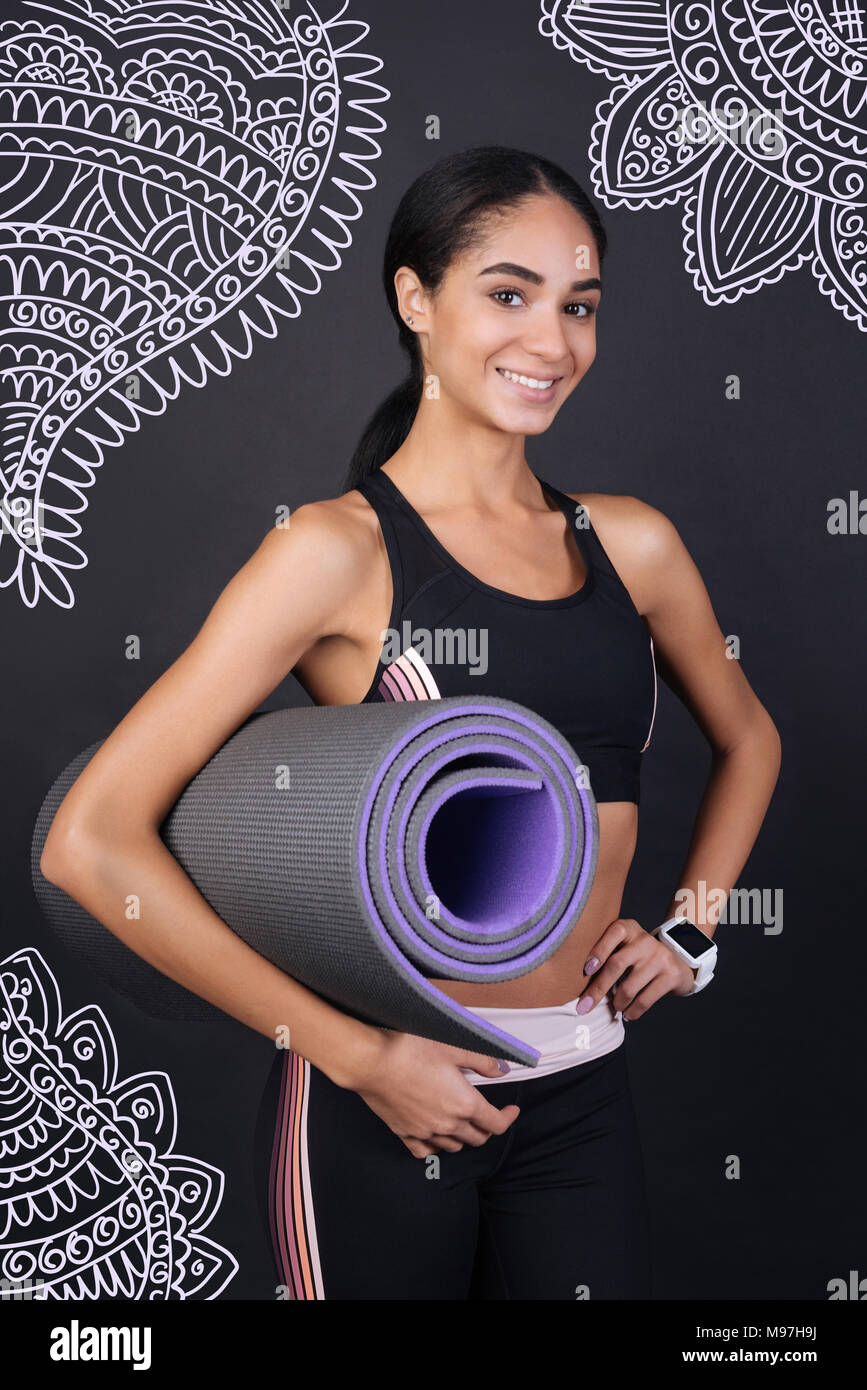 Young slim person smiling and feeling ready for a long training Stock ...