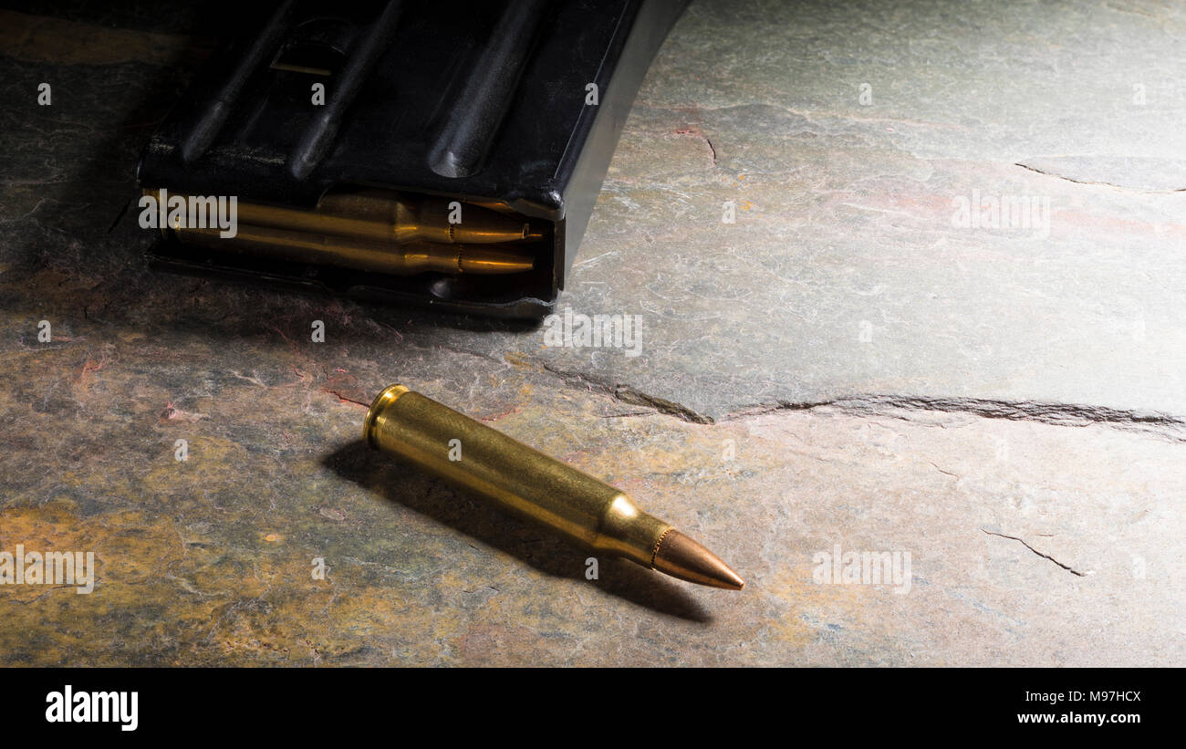 Magazine for an assault rifle along with a loaded cartridge Stock Photo ...
