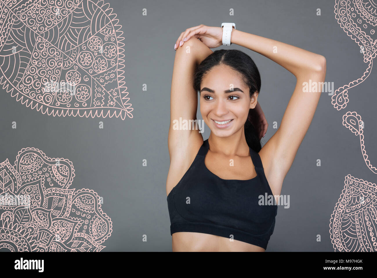 Beautiful girl looking to the right while standing and smiling Stock ...