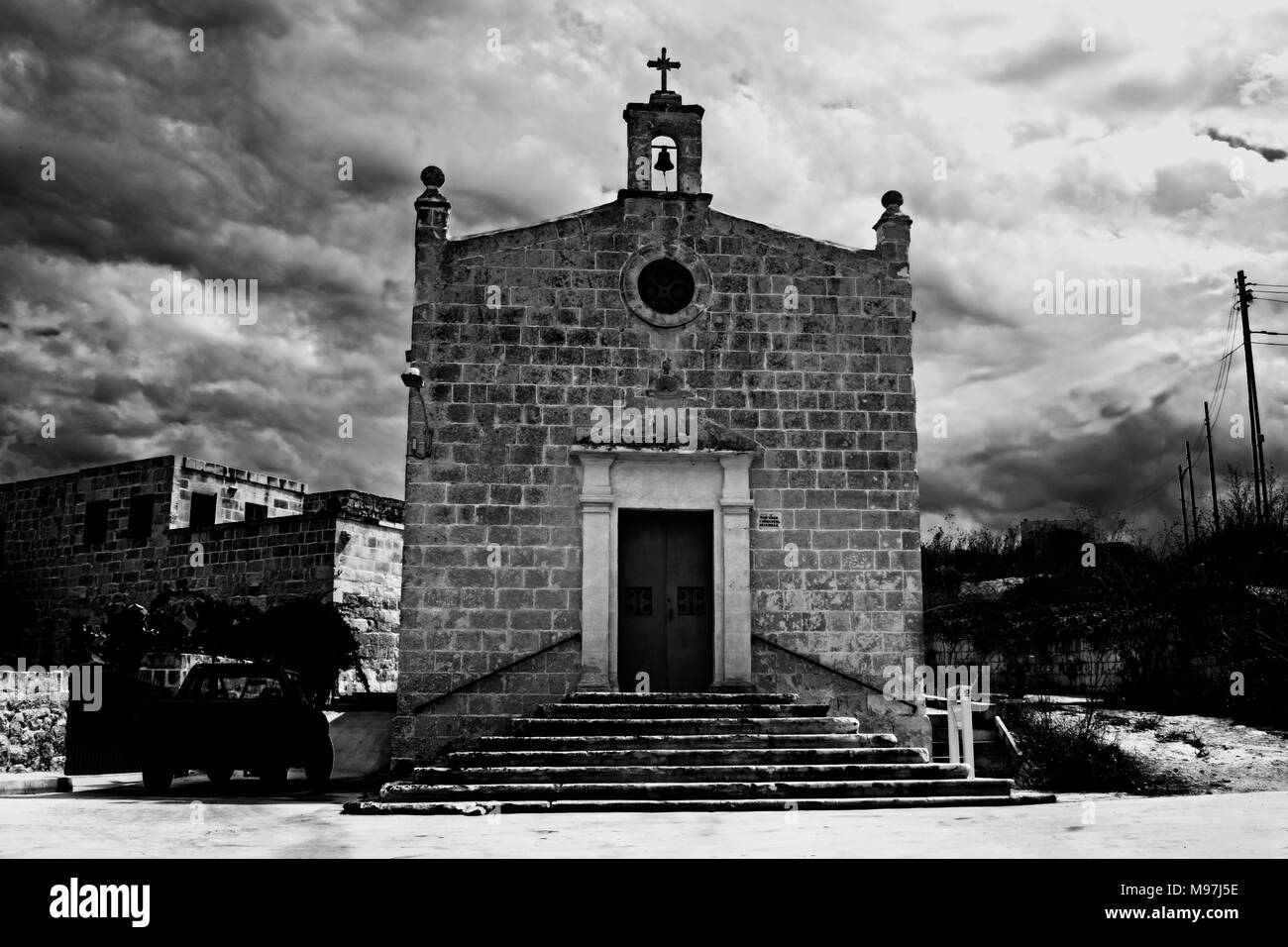 An old chapel in Malta with a storm building up in the background Stock ...