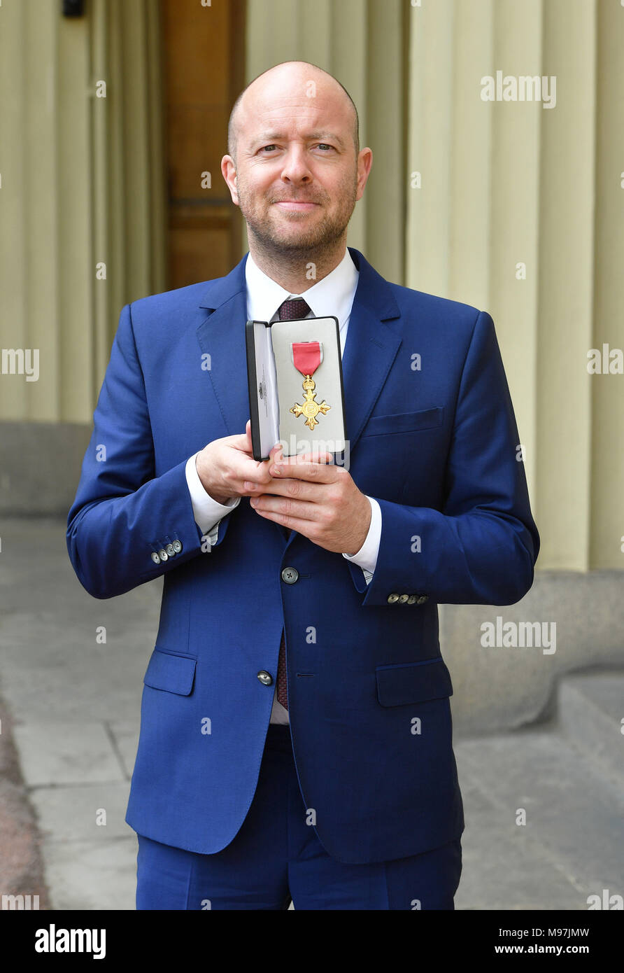 Theatre director John Tiffany holds his OBE following an investiture ...