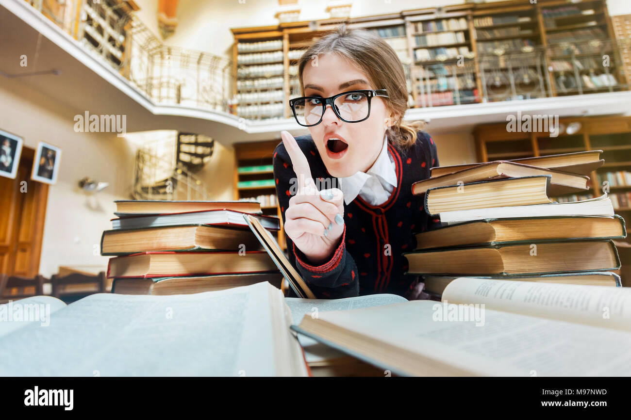 Girl with Books in the Library Stock Photo - Alamy