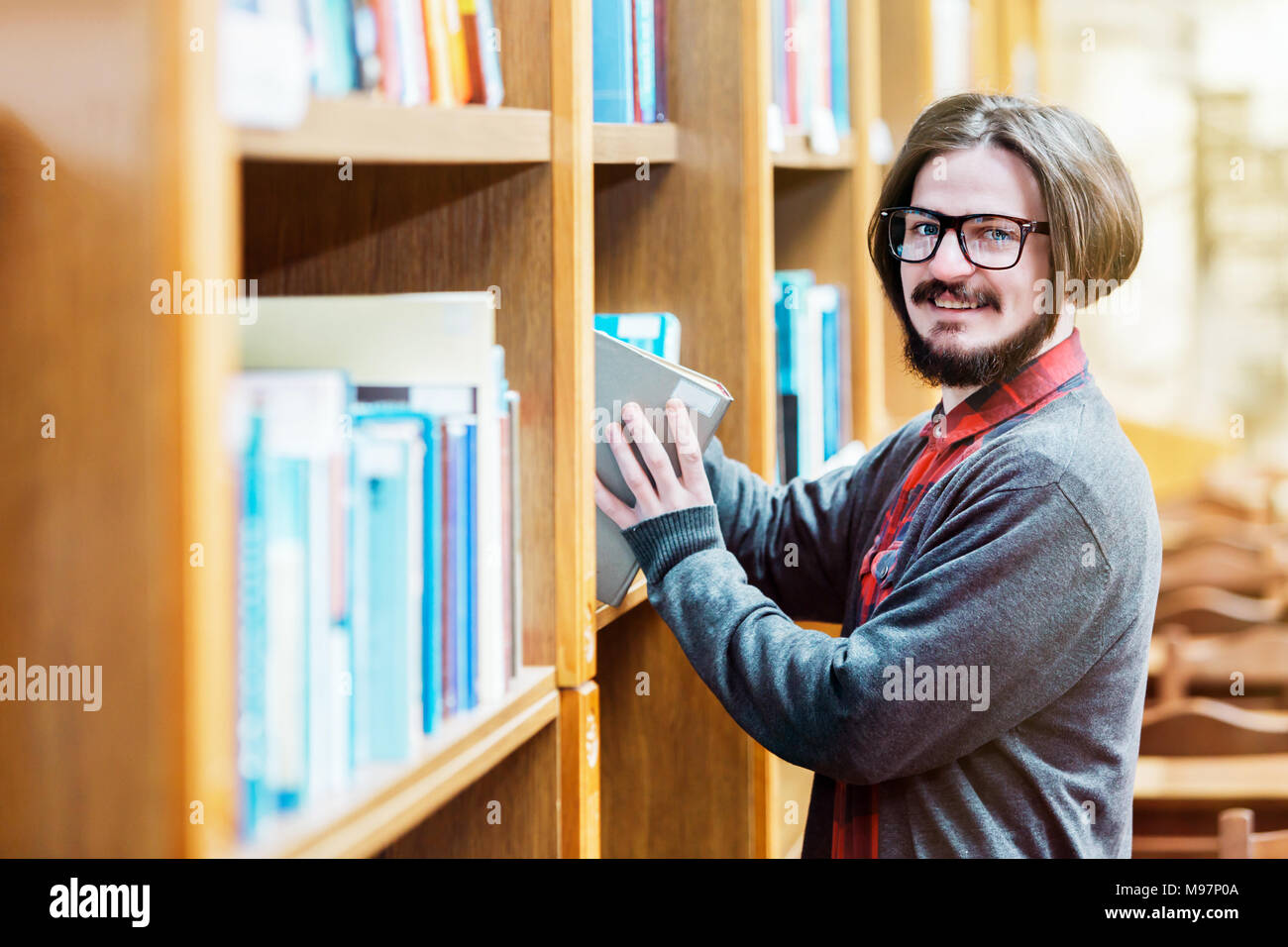 Student Man in the Library Stock Photo - Alamy