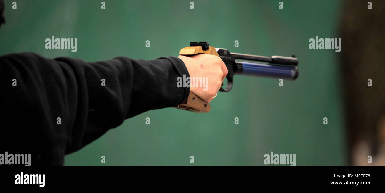 man with a gun fires at the shooting range Stock Photo - Alamy