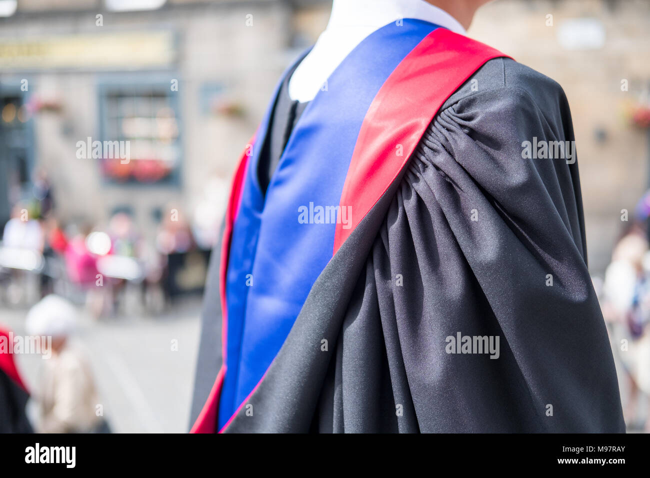 Back view of an unidentified graduate student with blur background of ...