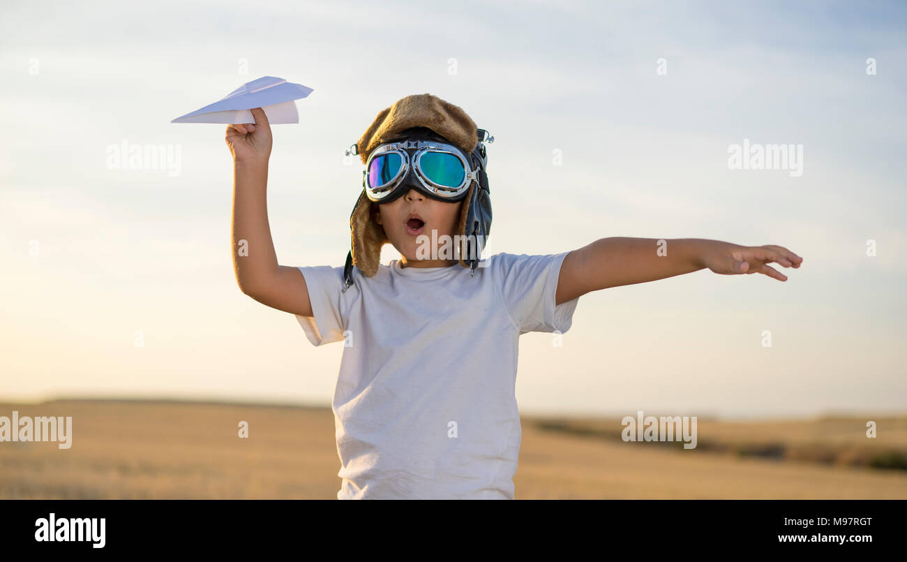 Little boy wearing helmet and dreams of becoming an aviator while ...