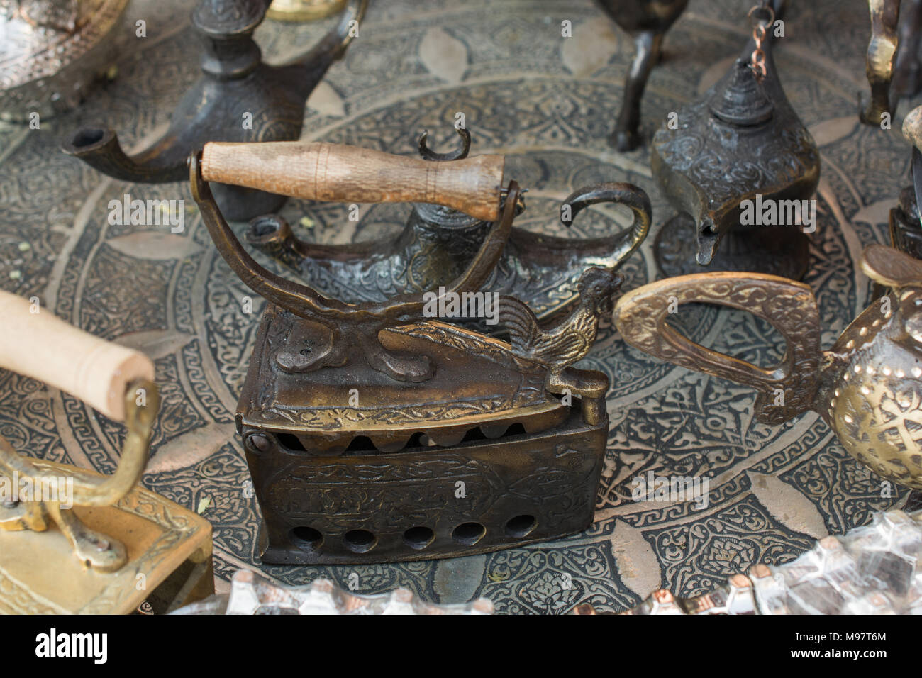 Retro metallized heavy antique iron tool for ironing Stock Photo - Alamy