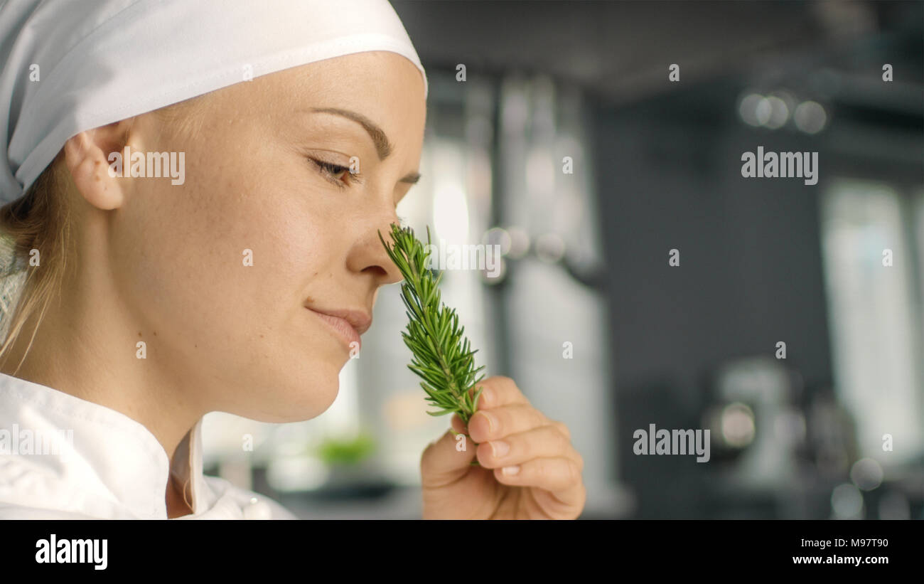 Beautiful young female chef smells hi-res stock photography and images ...