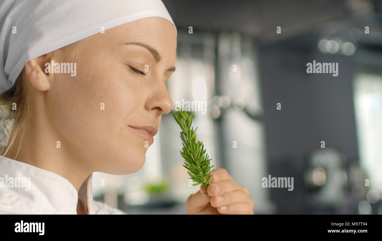 Smiling young female chef hi-res stock photography and images - Alamy