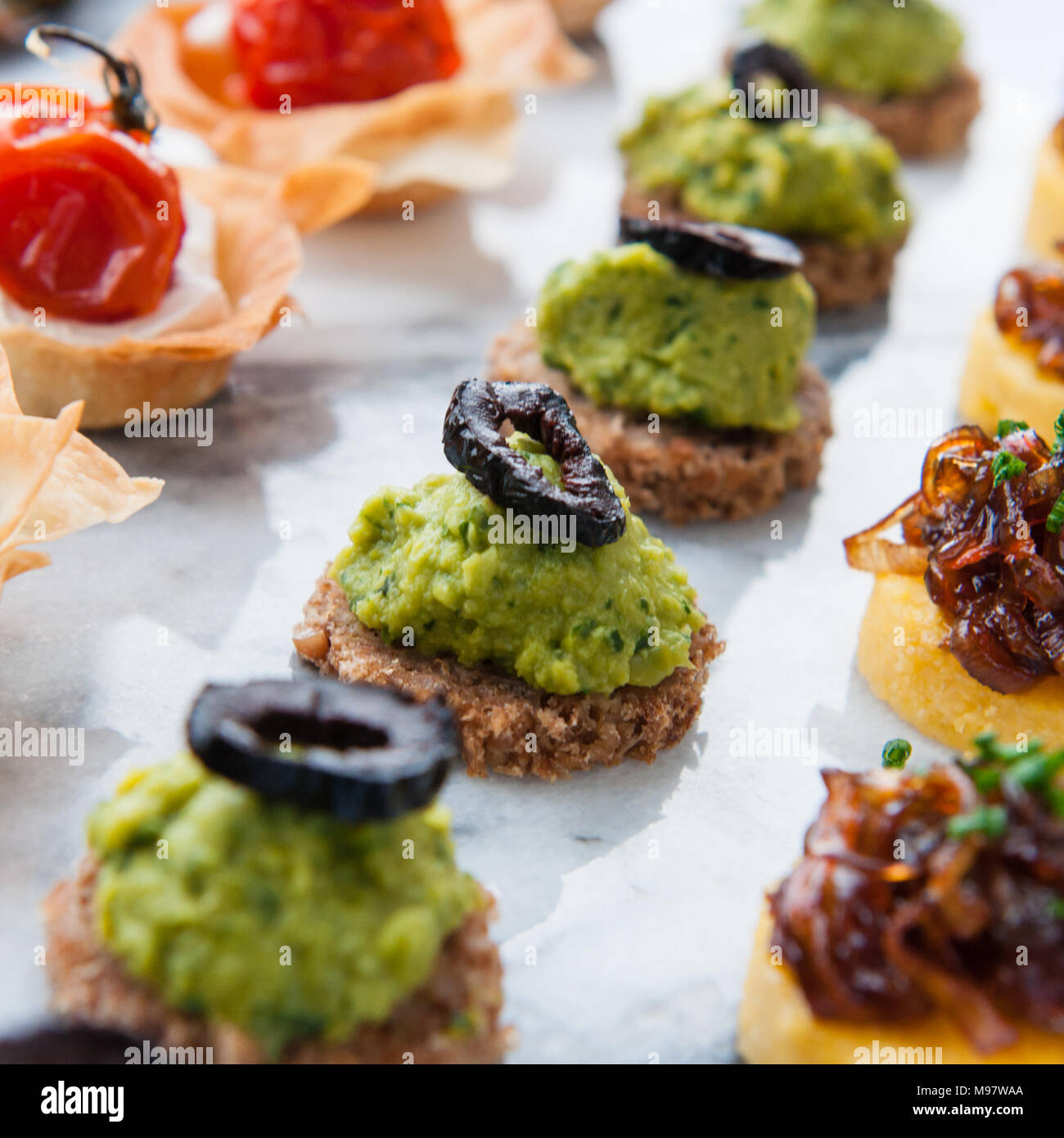 group of canapés on serving board Stock Photo - Alamy
