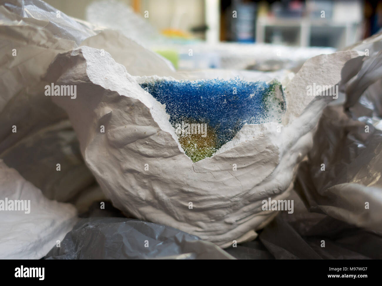 Pate de Verre, being broken from a plaster mold Stock Photo - Alamy