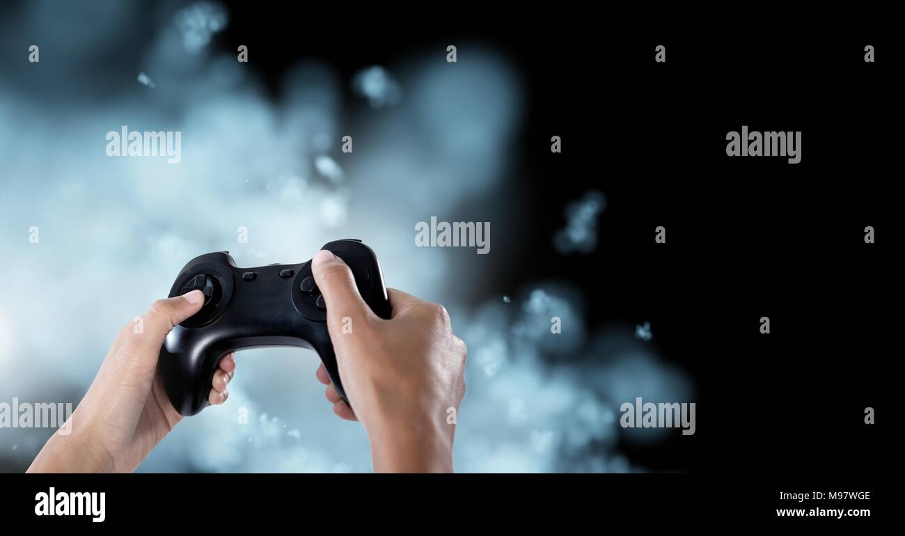 Hands holding gaming controller Stock Photo - Alamy