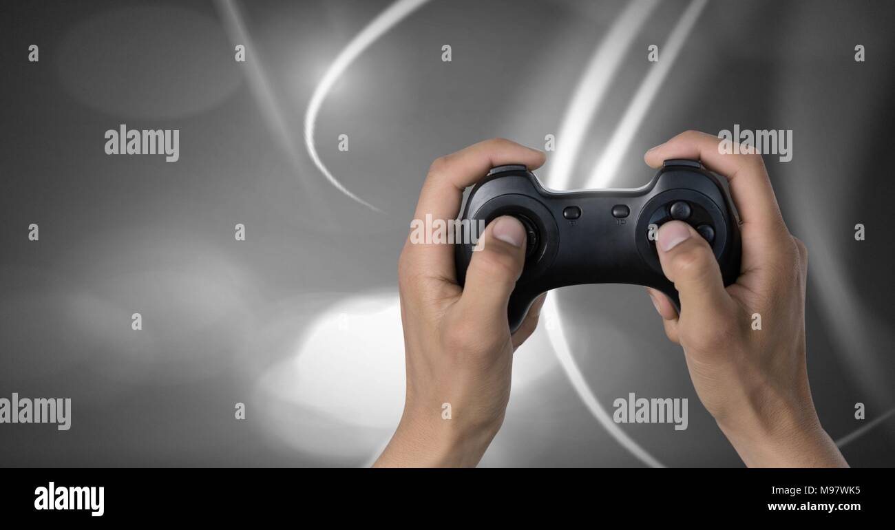 Hands holding gaming controller Stock Photo - Alamy