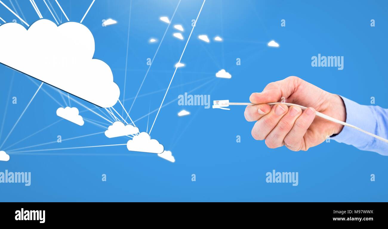 Hand holding wire connection with clouds Stock Photo - Alamy