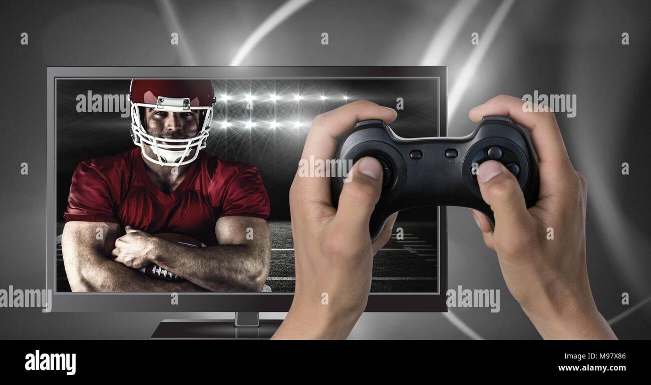 Playing American football computer game with controller in hands Stock ...