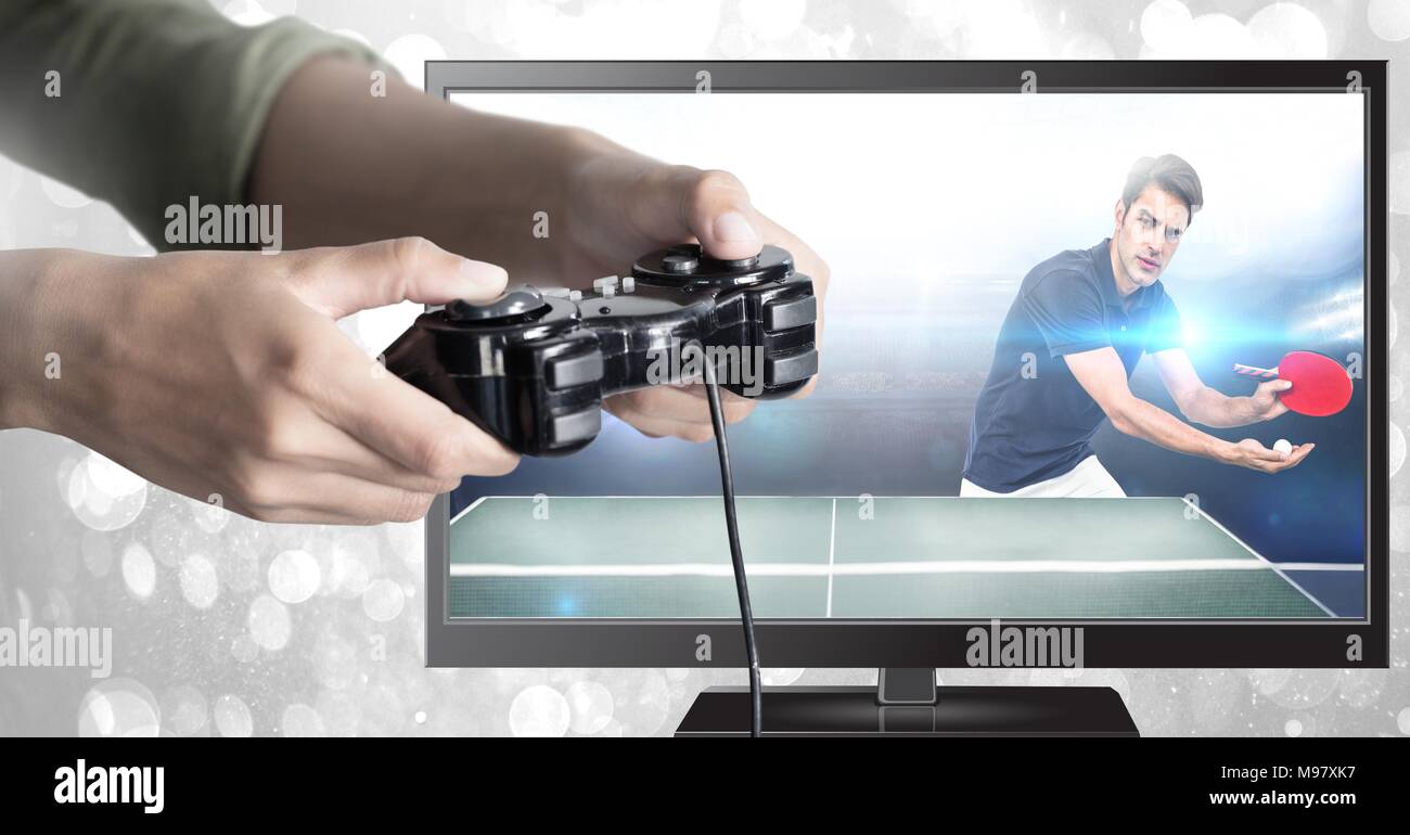 Hands holding gaming controller with table tennis on television Stock ...
