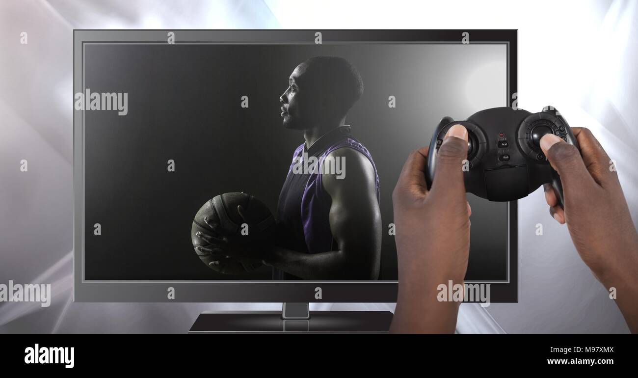 Hands holding gaming controller with basketball on television Stock ...