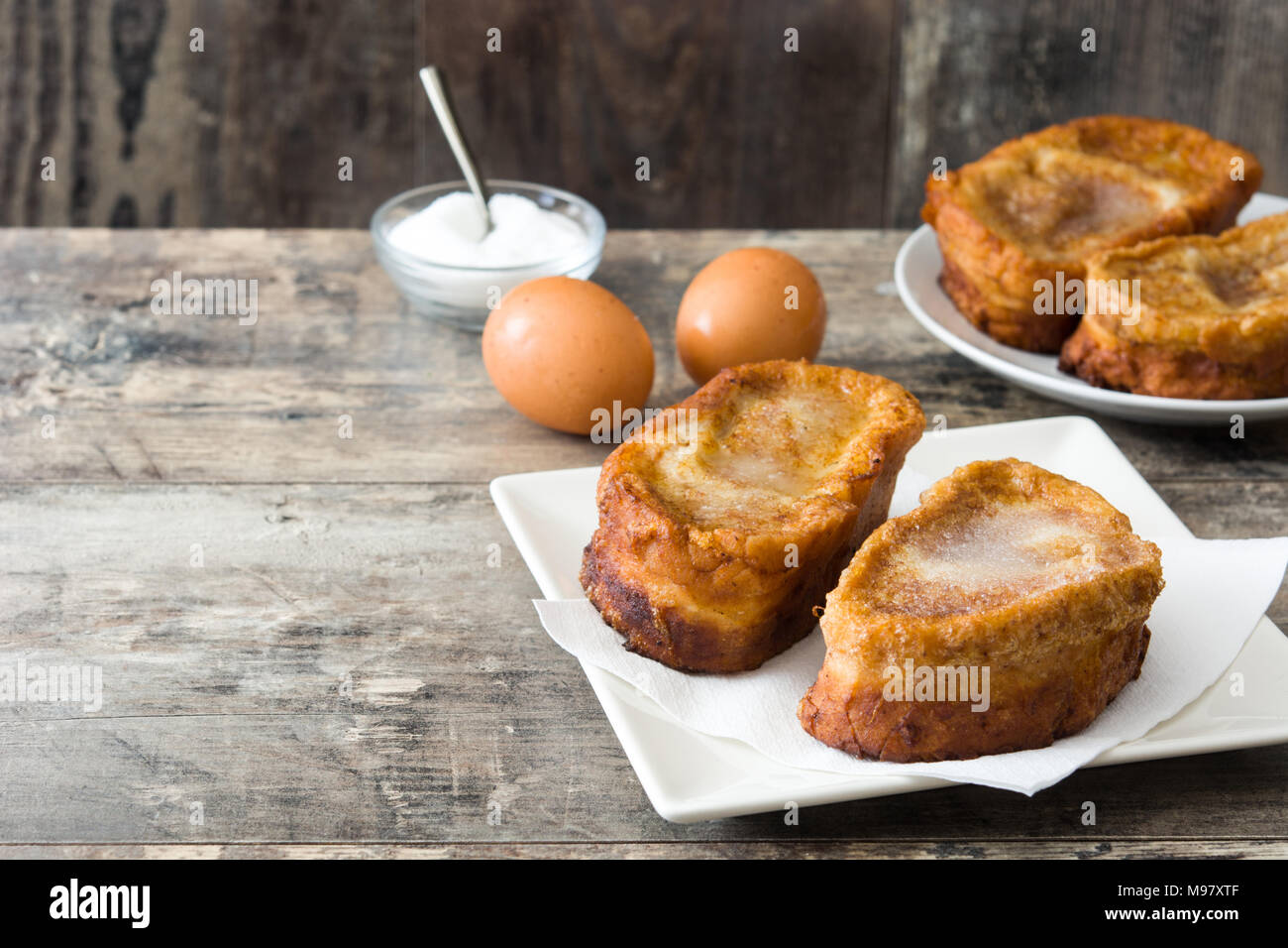 Traditional homemade Spanish torrijas on wooden background. Easter ...