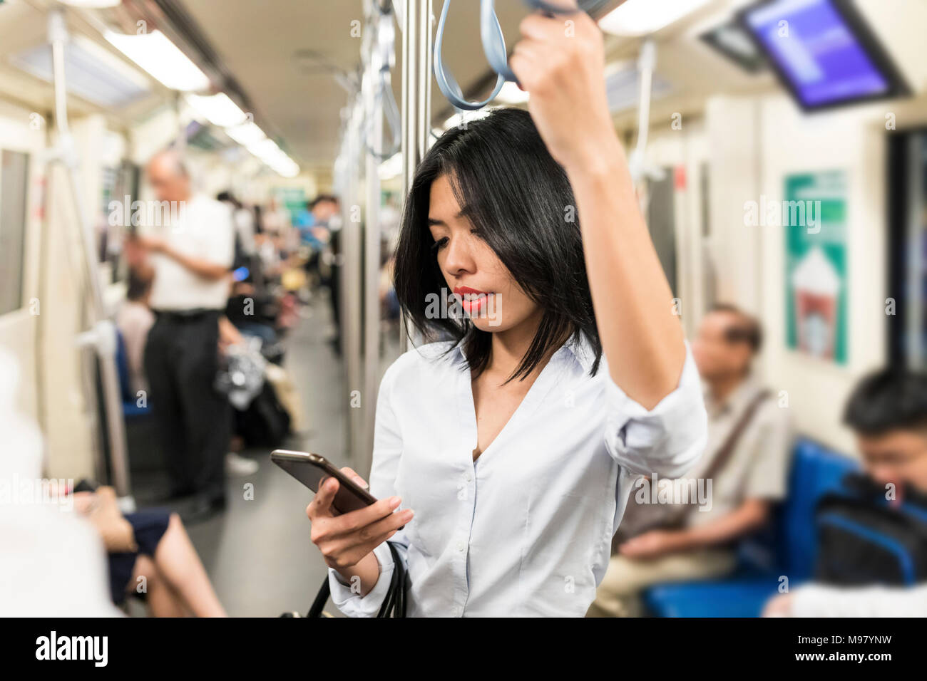 Asian phone subway hi-res stock photography and images - Alamy