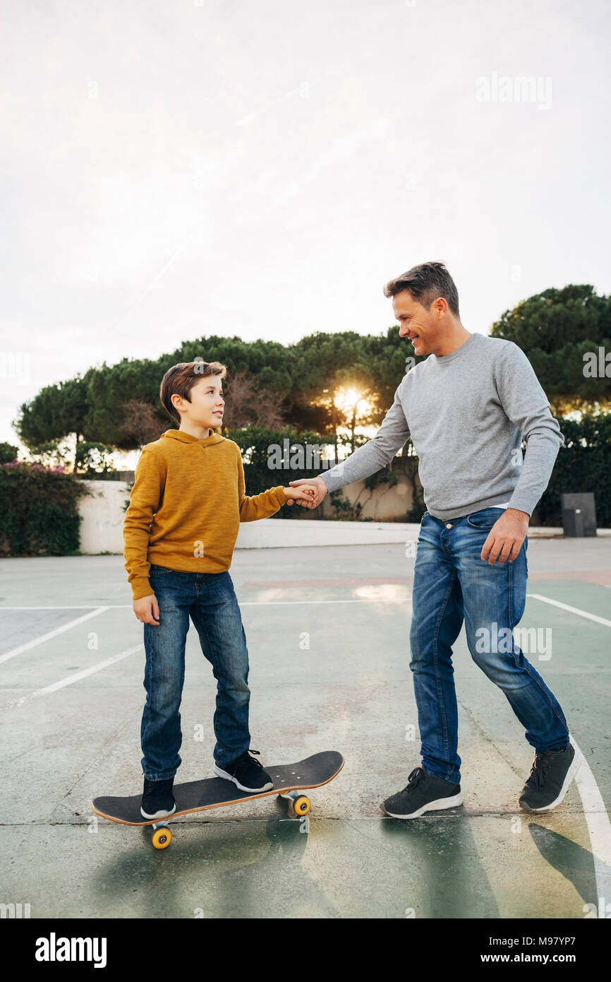 Child assisting parents hi-res stock photography and images - Alamy