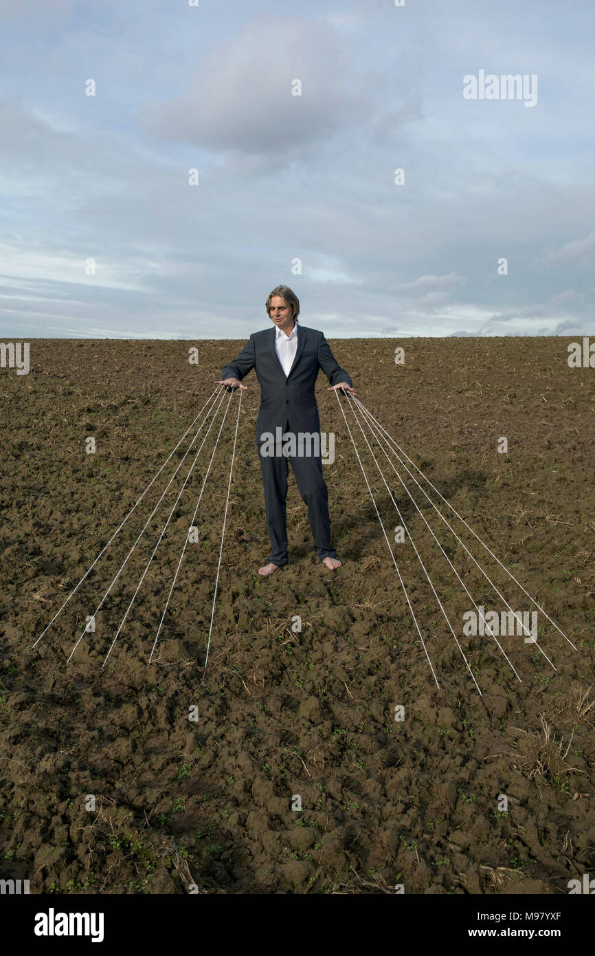 Puppet strings men hi-res stock photography and images - Alamy