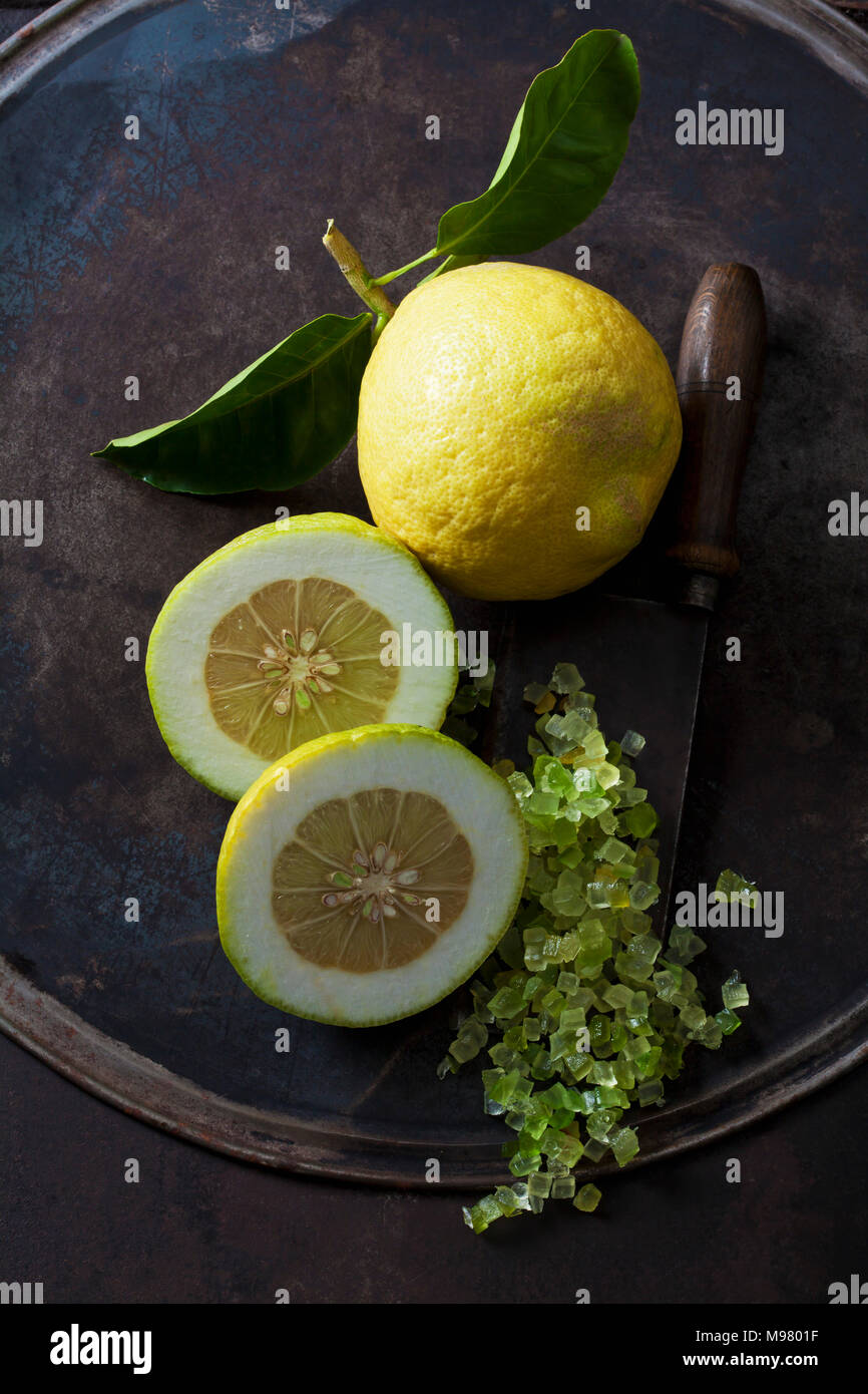 Whole and half citron, citronat and cleaver Stock Photo - Alamy