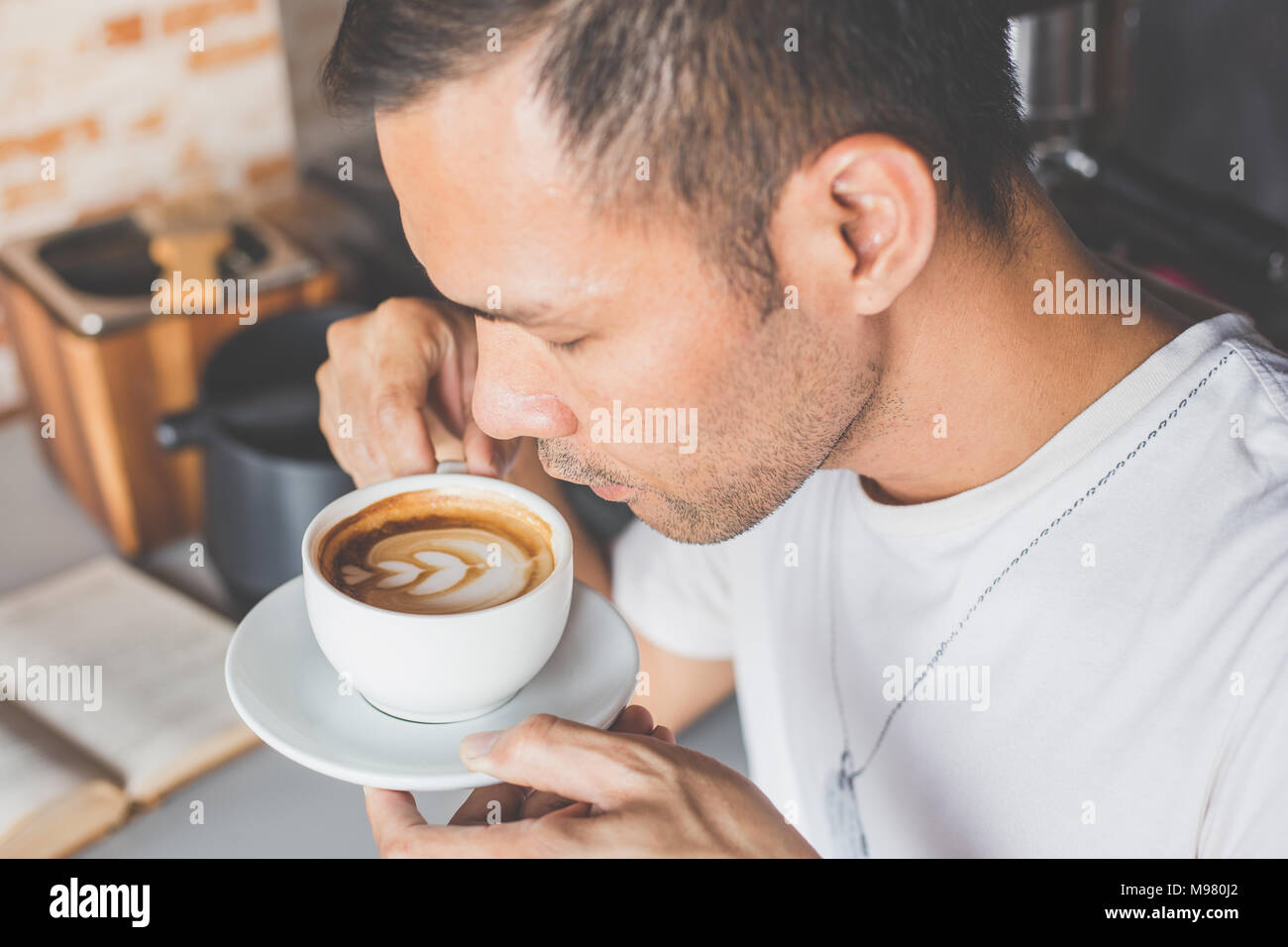 Handsome man feeing smell from coffe cup and closed eyes drinking ...