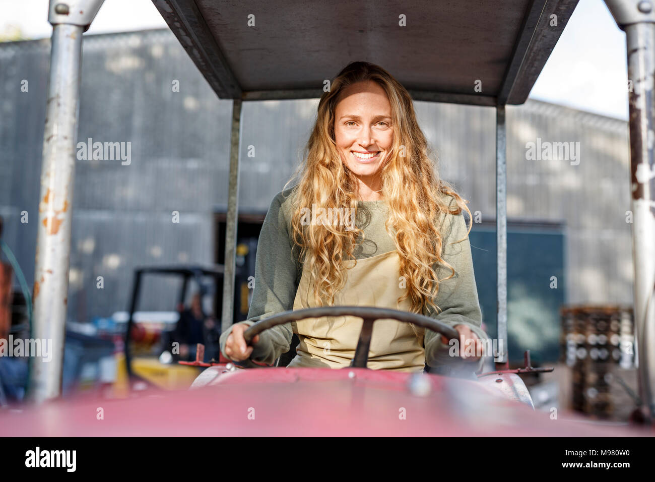 Woman driving tractor hi-res stock photography and images - Alamy