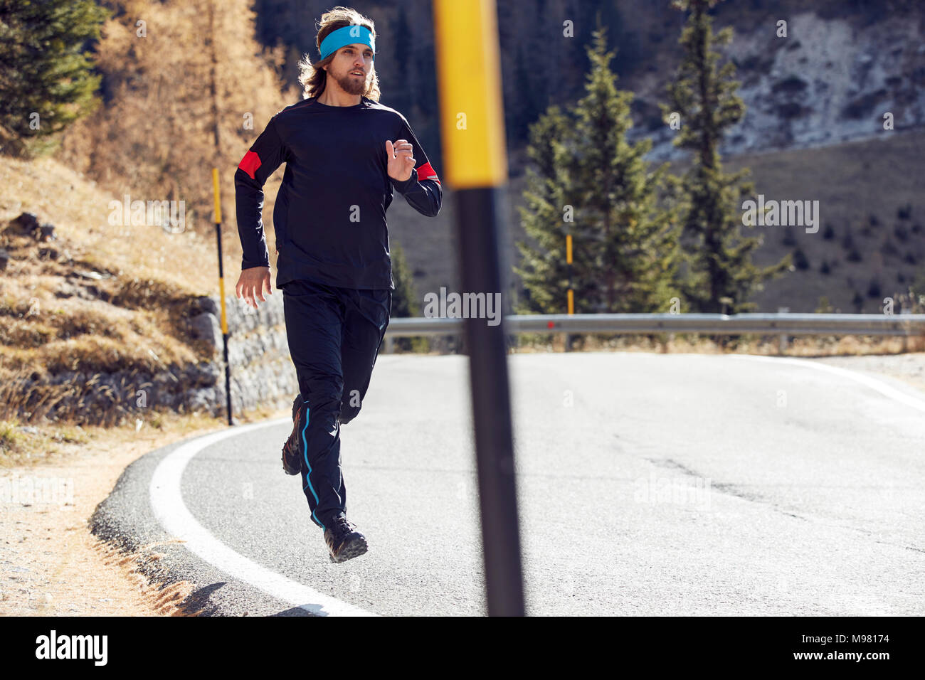 Person running road mountain hi-res stock photography and images - Alamy