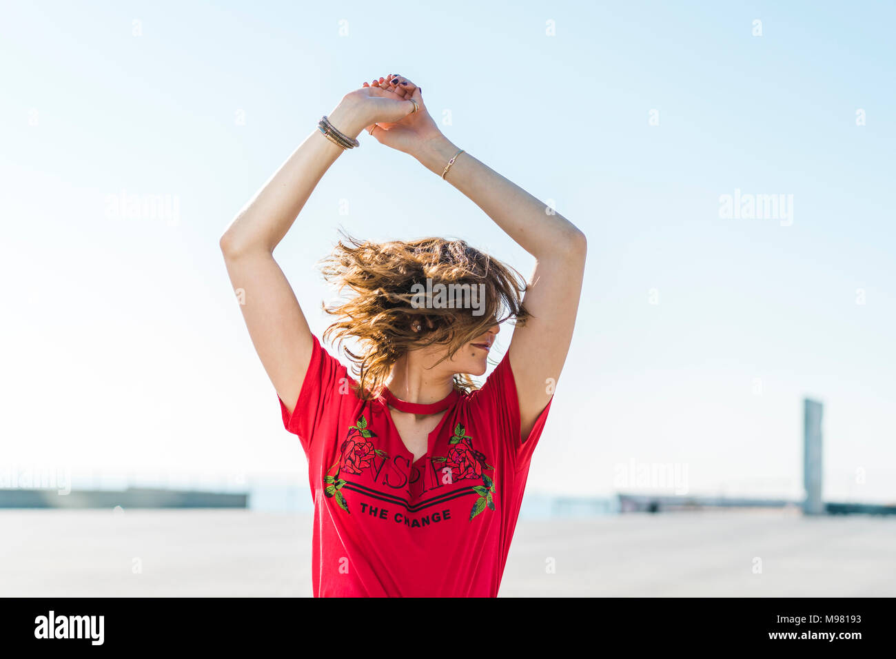 Woman shaking hair red hi-res stock photography and images - Alamy