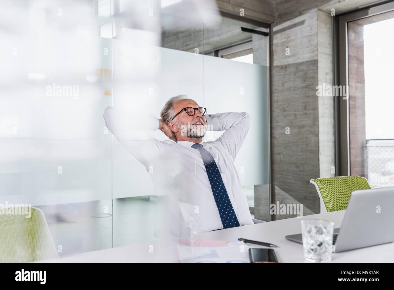 Businessman desk office leaning back hi-res stock photography and ...