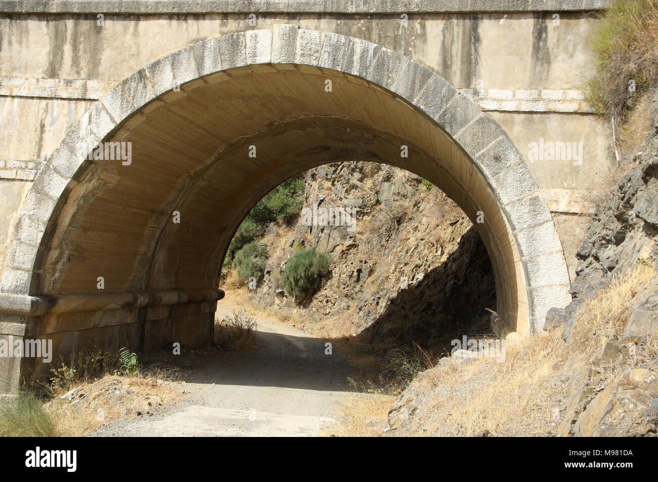 Ancient arch bridge in the mountains of Andalucia Stock Photo - Alamy