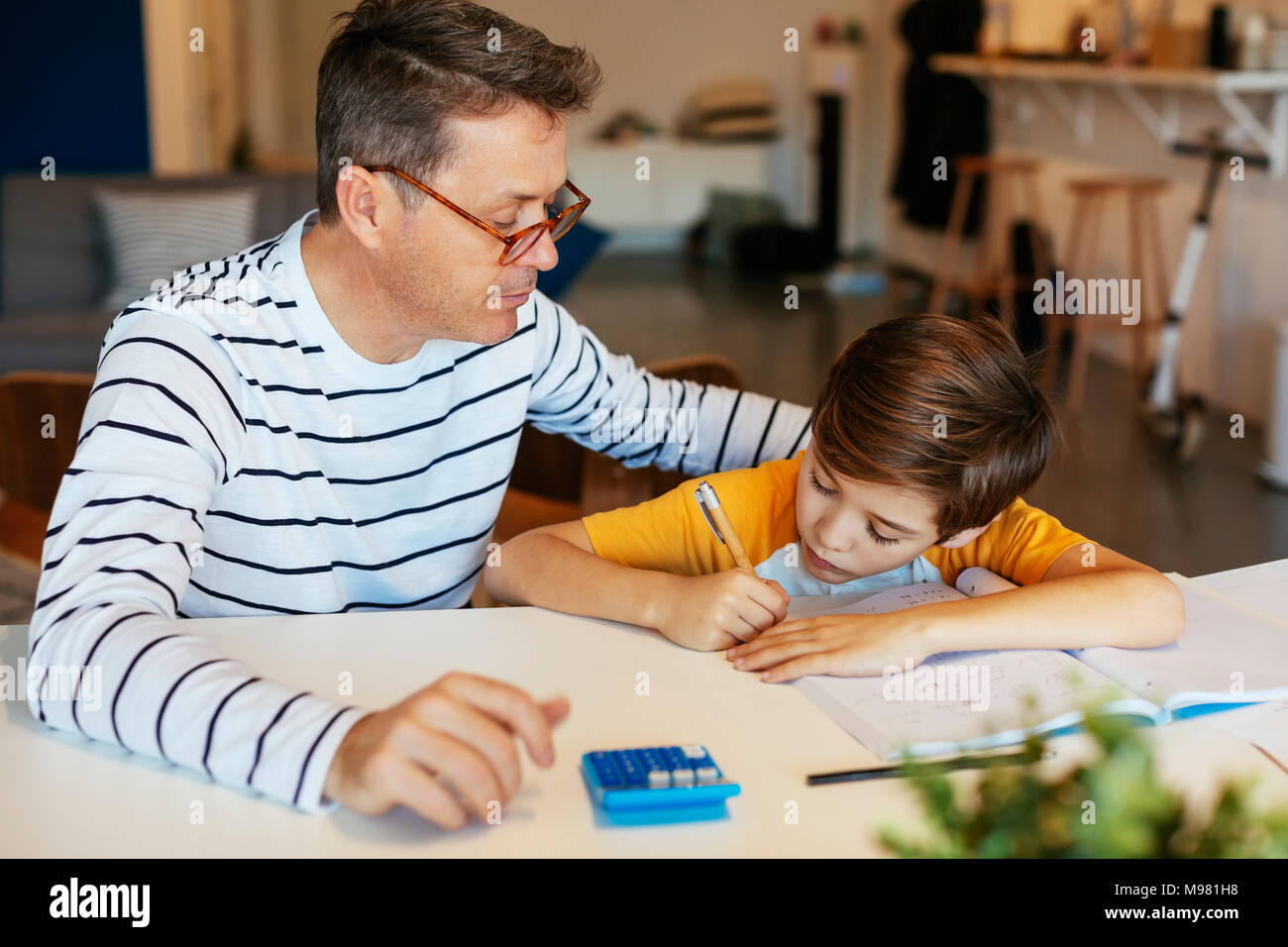 Father watching son hi-res stock photography and images - Alamy