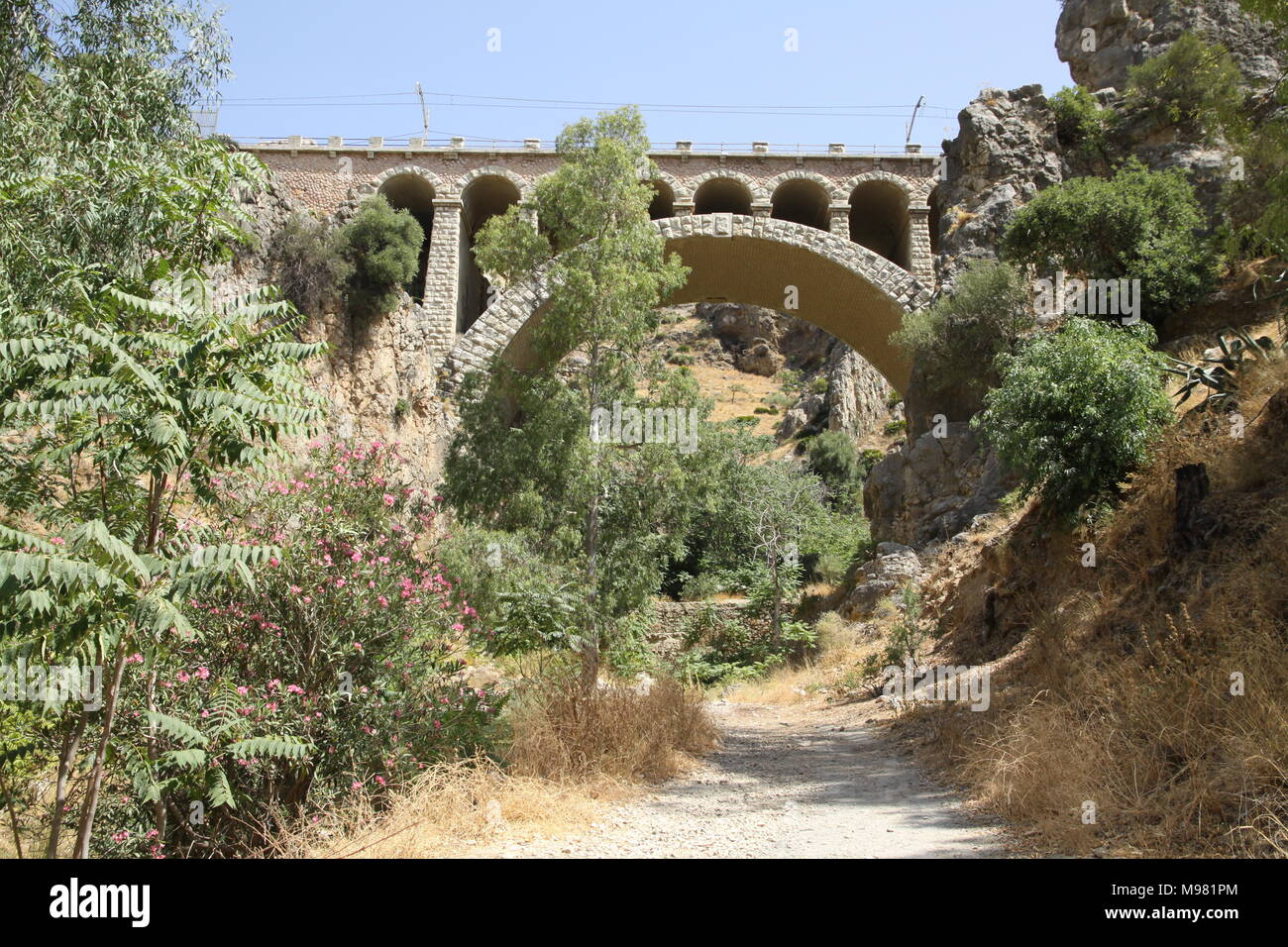 Ancient arch bridge in the mountains of Andalucia Stock Photo - Alamy
