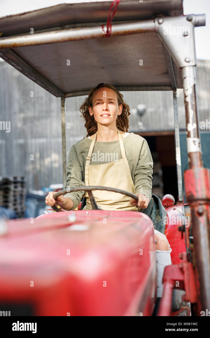 Woman driving tractor hi-res stock photography and images - Alamy