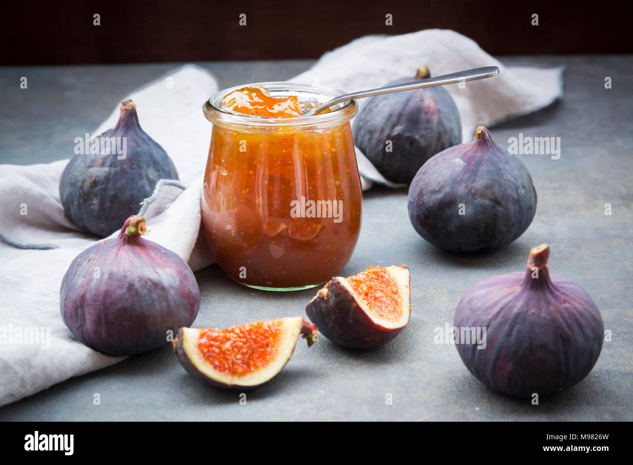 Organic figs and a glass of fig jam Stock Photo - Alamy