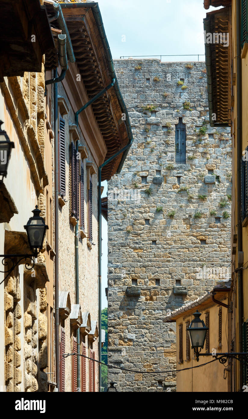 Summer ancient walled mountaintop town Volterra street scene, Pisa ...