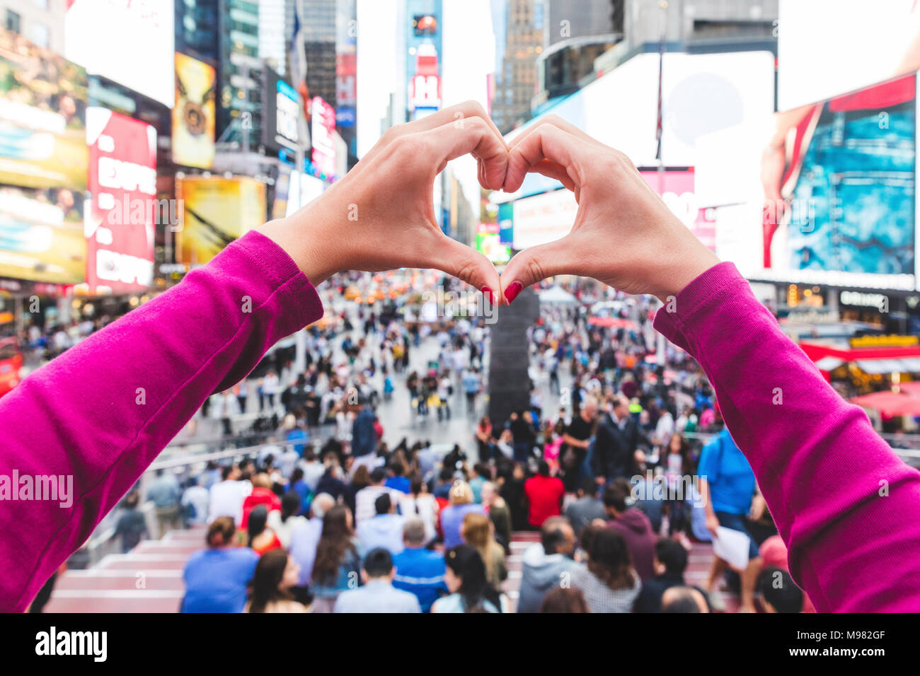 Heart shaped hands on times square hi-res stock photography and images ...