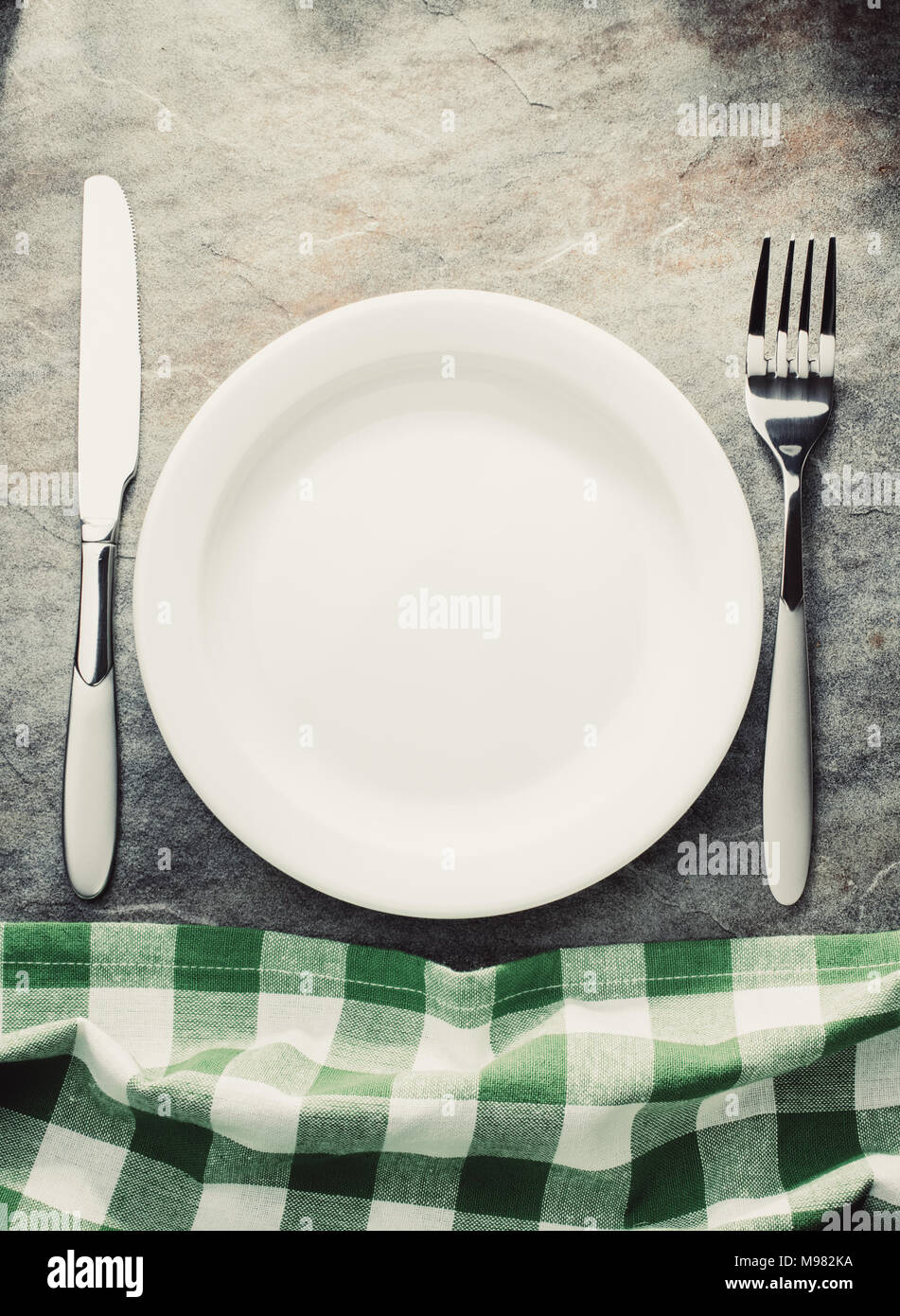 plate and napkin at table background Stock Photo - Alamy