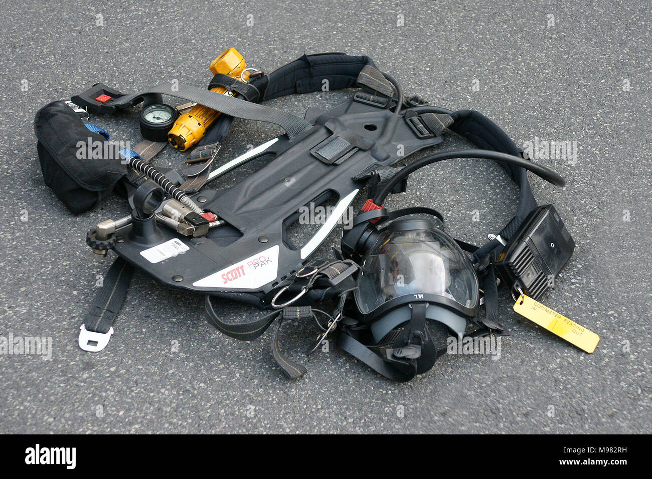 fire fighters at incident, fighting fire in full fire kit with ...